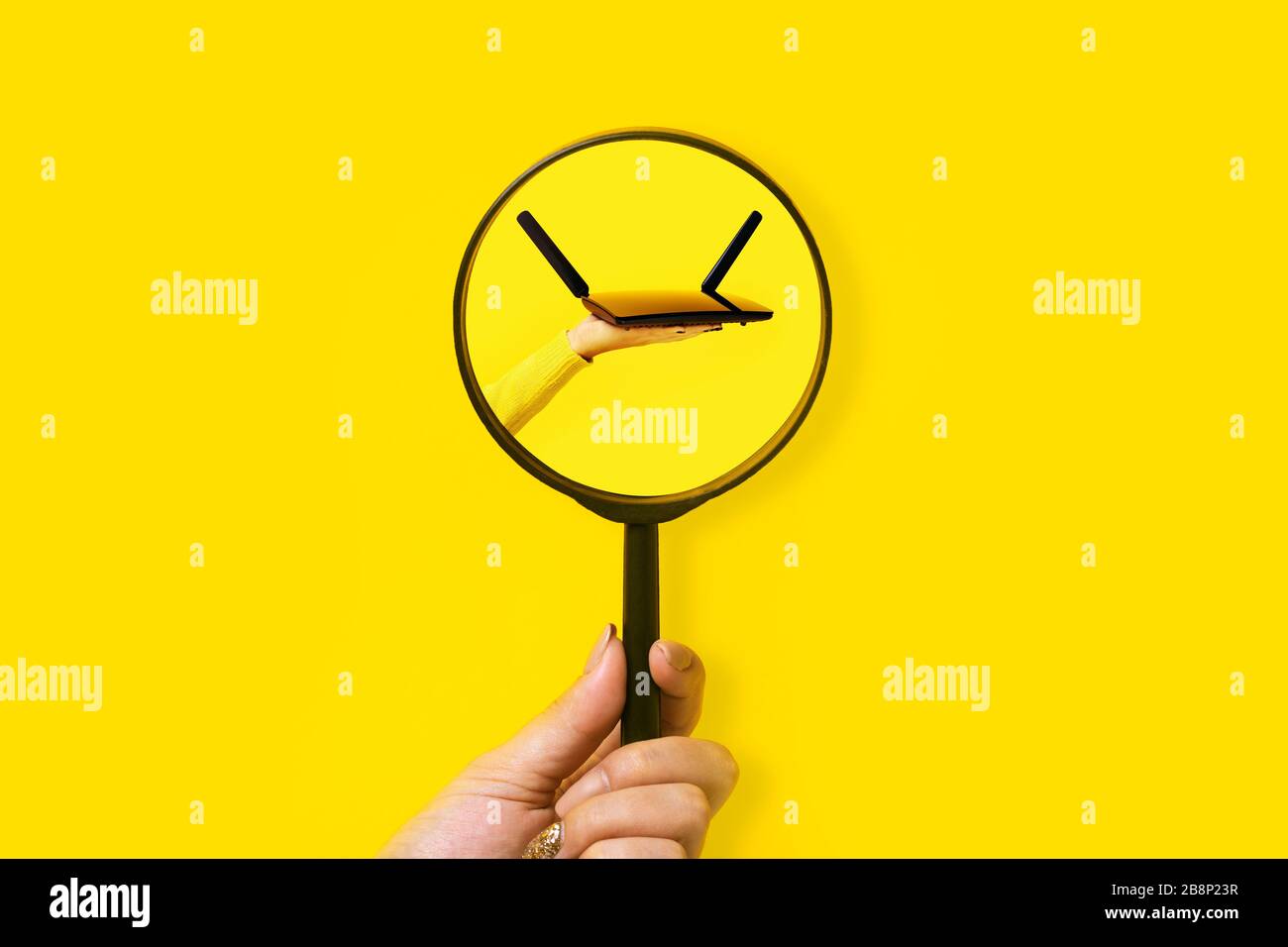 router and magnifier in hand, wifi search concept Stock Photo - Alamy