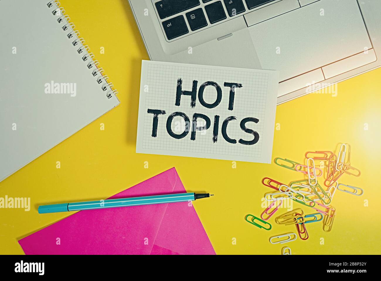 Writing note showing Hot Topics. Business concept for subject that a ...