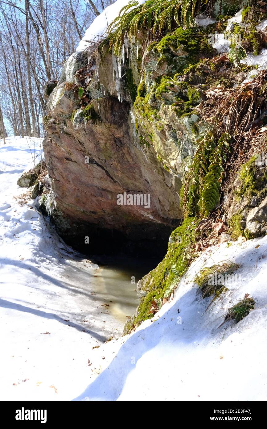 Naturally occurring grotto / cave in winter in Gatineau Park, Quebec ...
