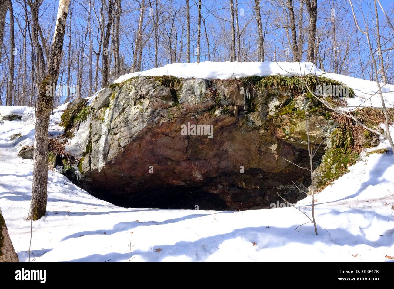 Naturally occurring grotto / cave in winter in Gatineau Park, Quebec ...