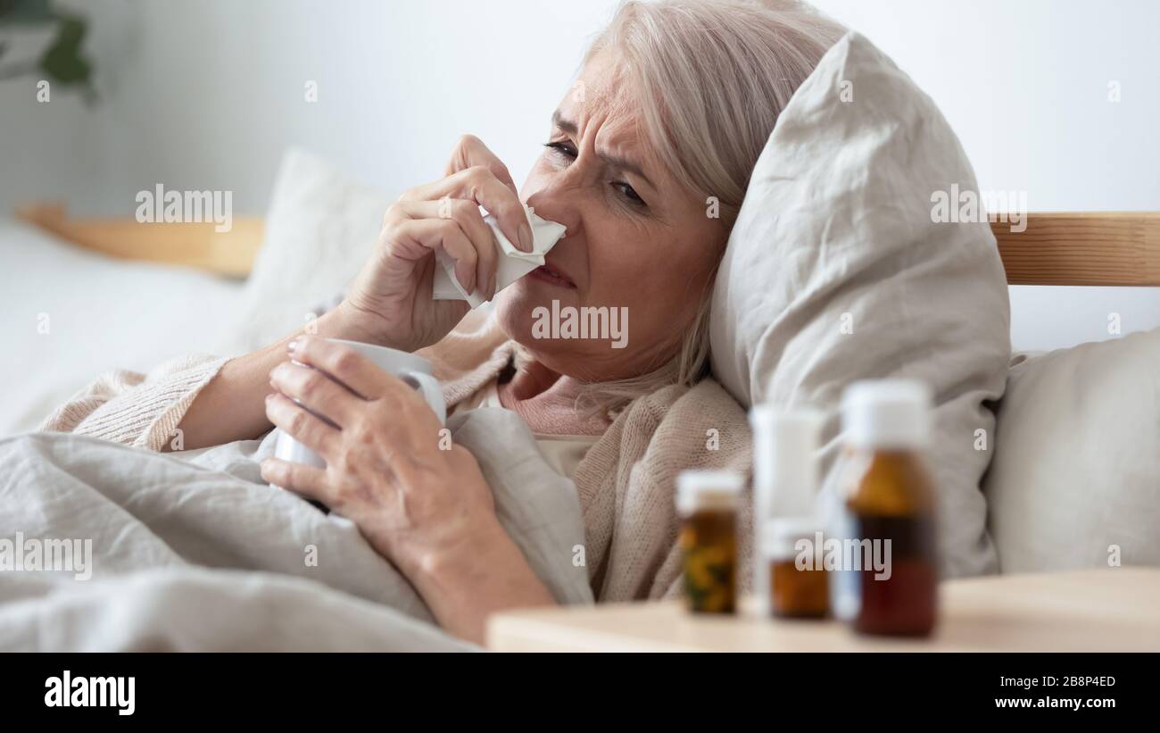 Mature woman fever ill hi-res stock photography and images - Alamy