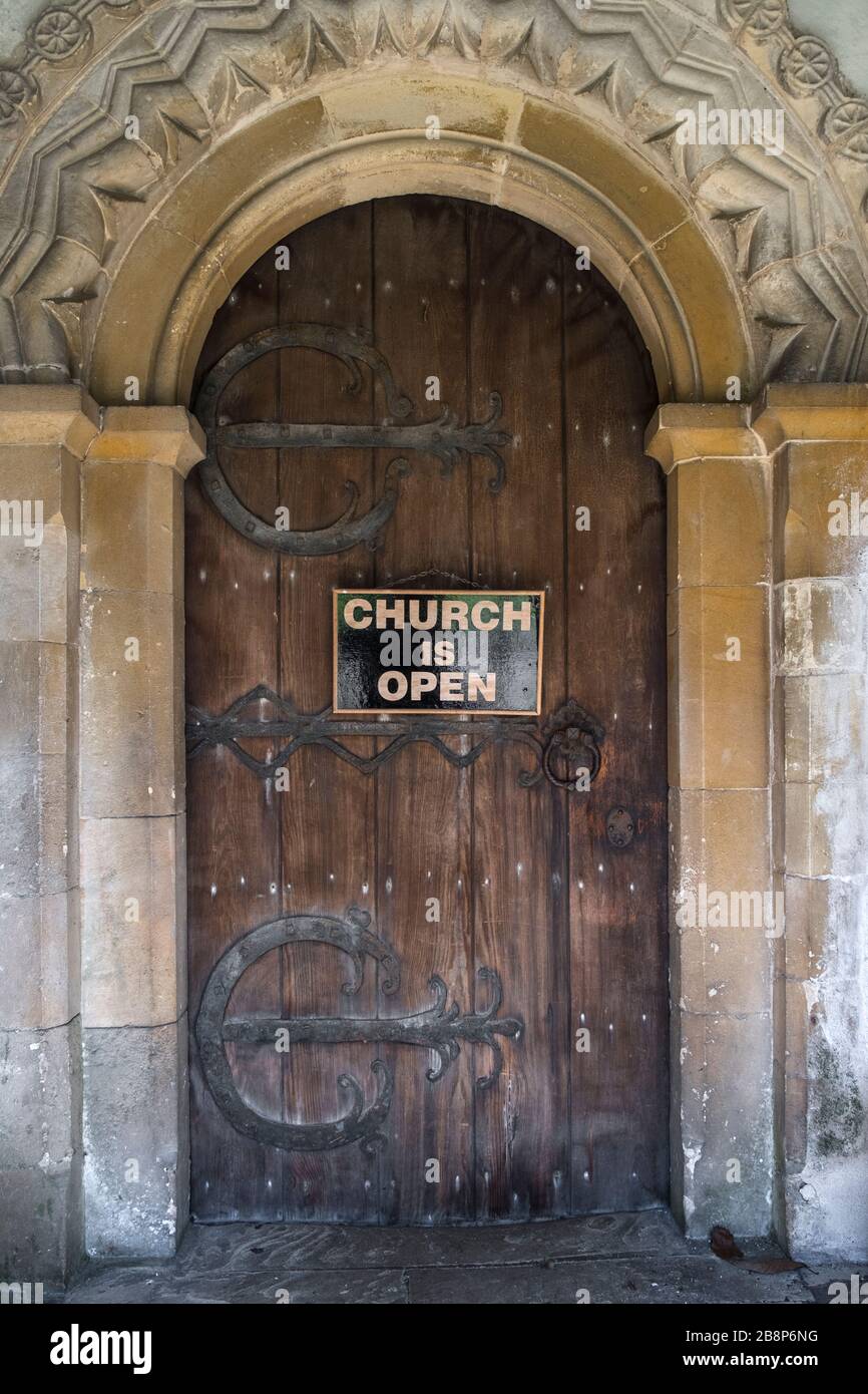 Church door with "Church is Open" sign. St Mary's church, Walpole ...