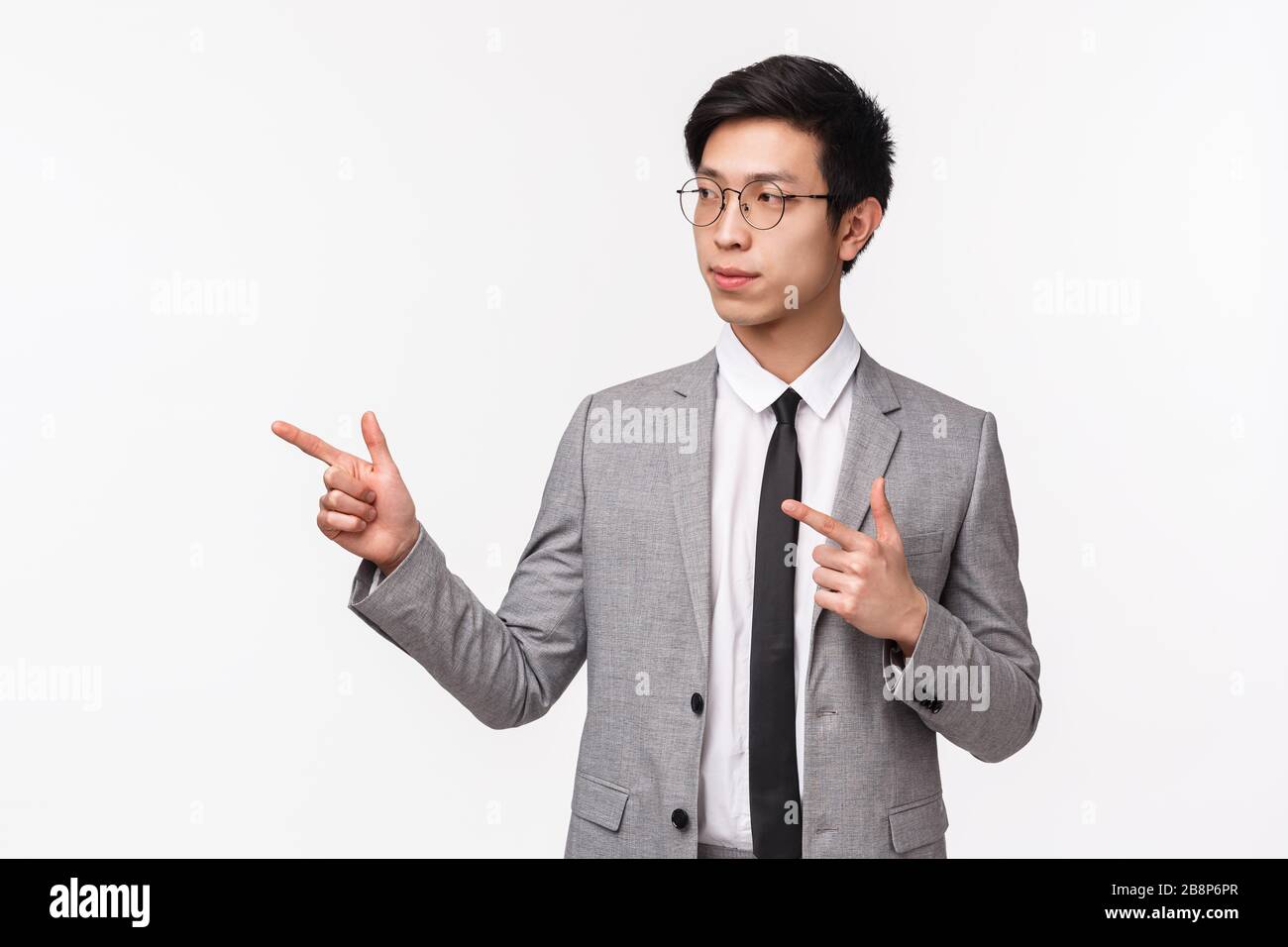 Portrait of determined smart businessman, asian guy in grey suit ...