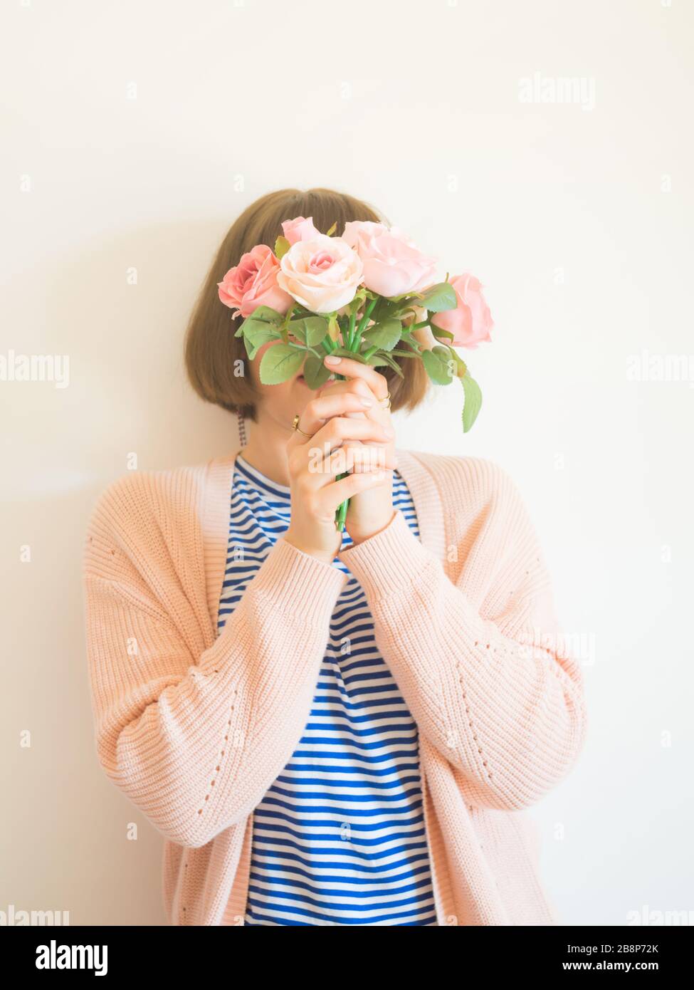 Girl Hiding Face With Flower