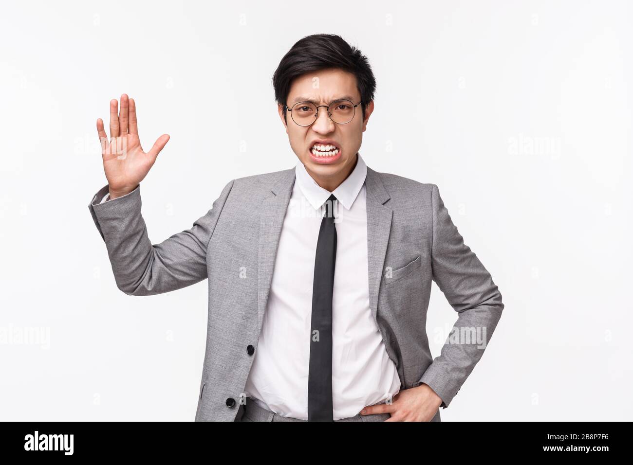 Waist-up potrait of angry, outraged asian businessman scolding ...