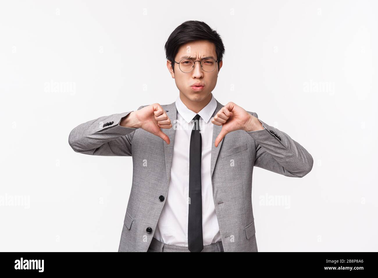 Waist-up portrait of skeptical and disappointed handsome asian ...