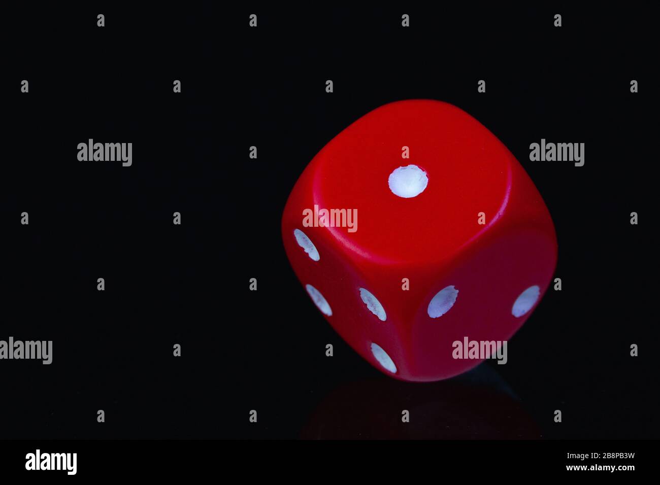 Red dice on the black background. Playing dice at black background ...