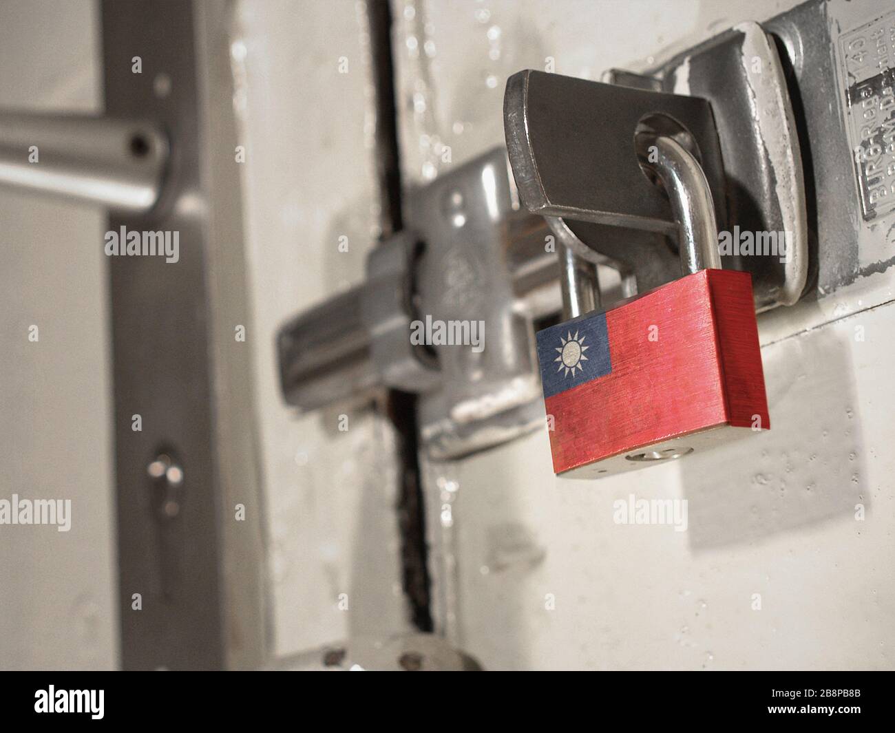 A bolted door secured by a padlock with the national flag of Taiwan on ...