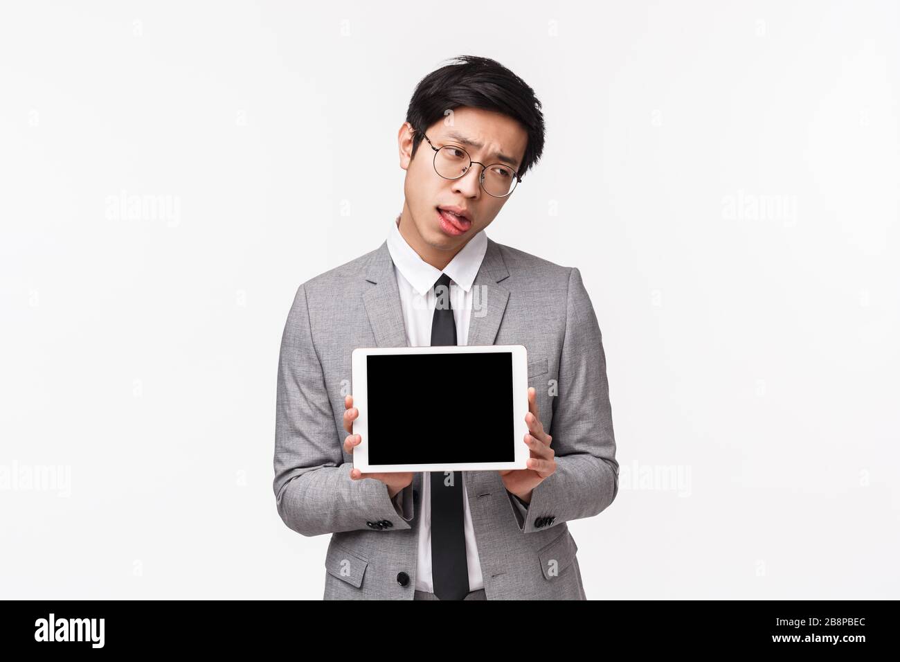 Waist-up portrait of bored reluctant and sad young asian man feeling ...