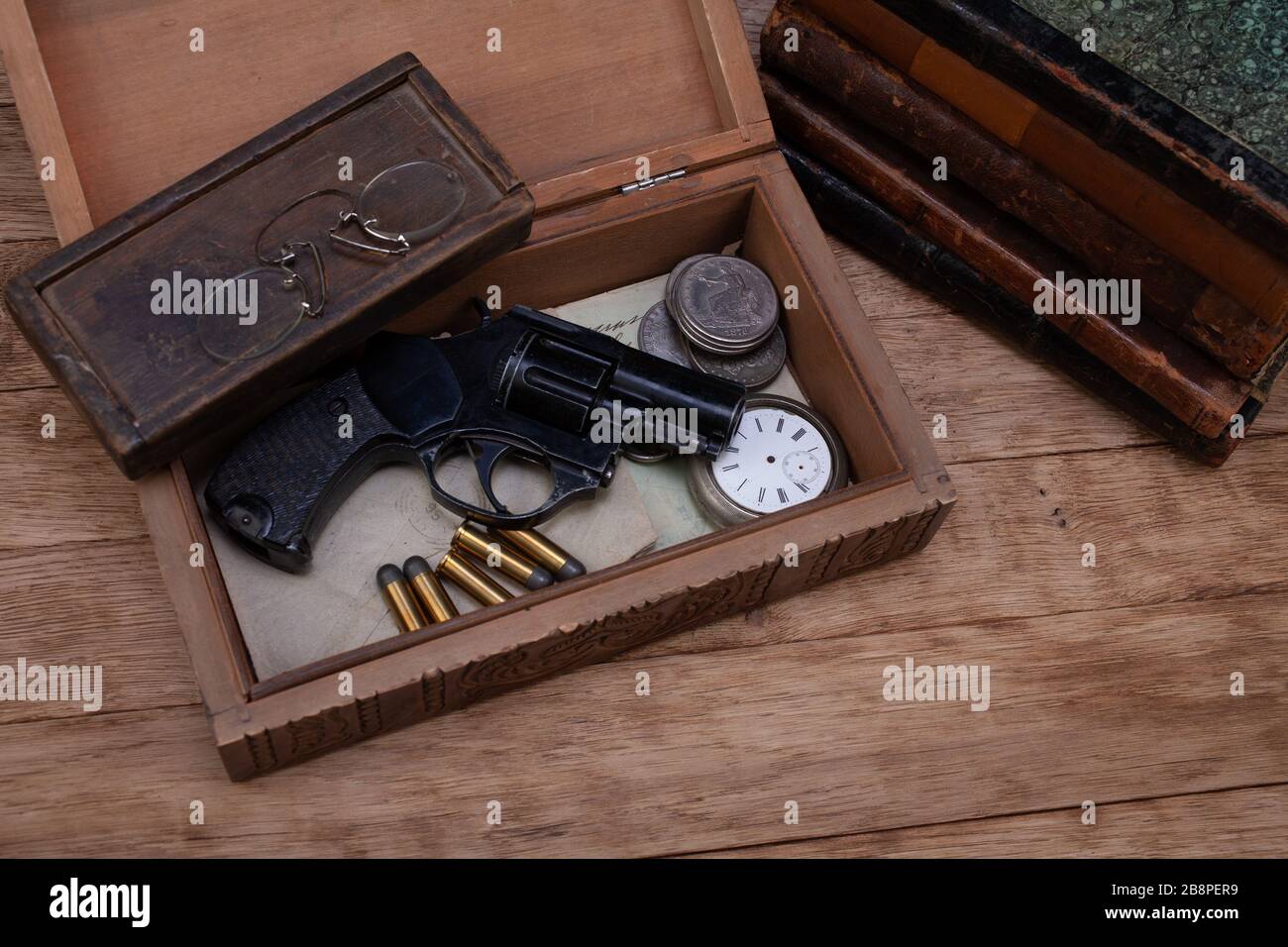 Old retro vintage revolver gun with ammunitions in wooden box for ...