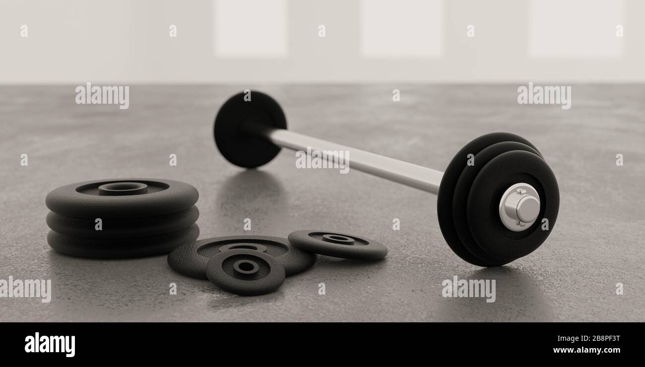 long metal dumbbells and black weights on gym floor and white ...