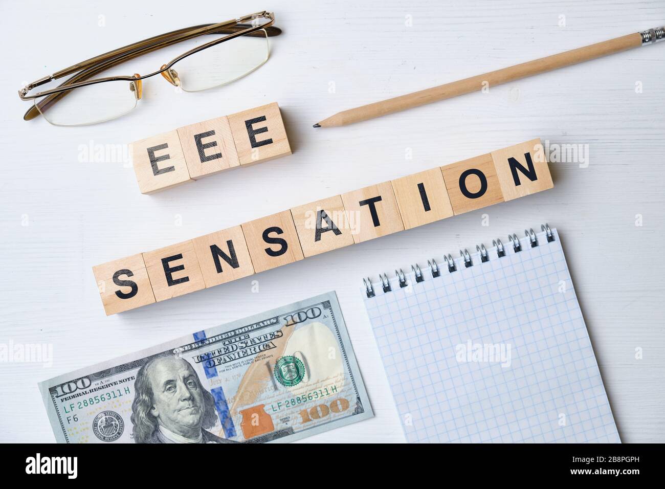 Modern business buzzword - eee sensation. Top view on the board ...