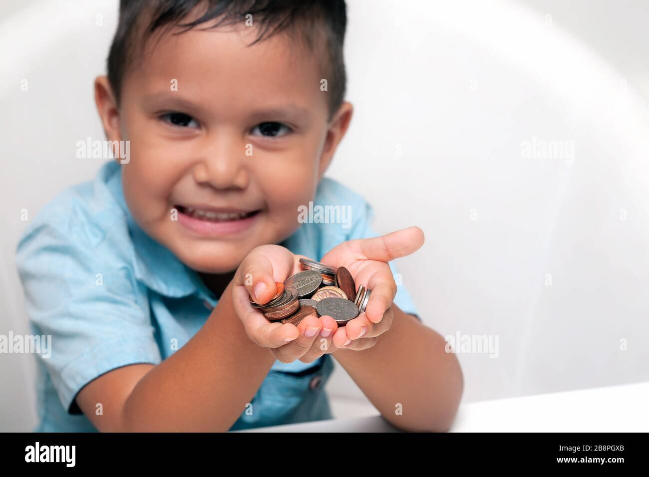 Old coin young hands hi-res stock photography and images - Alamy
