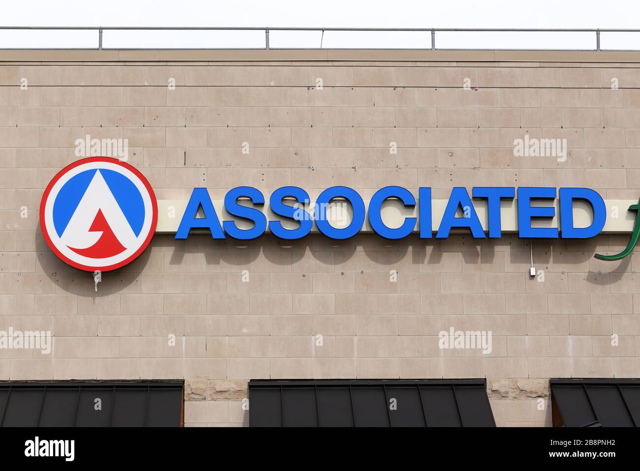 An Associated Supermarket logo on a masonry wall at a store in New York ...