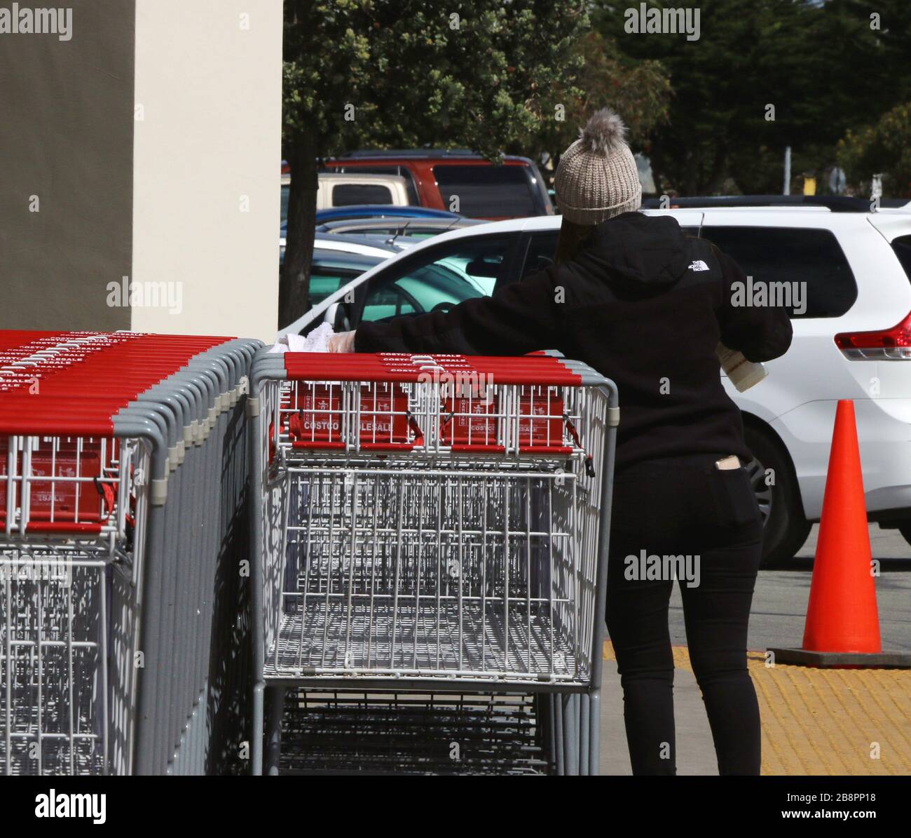 Editorial: A Costco employee carefully sanitizes shopping carts during ...