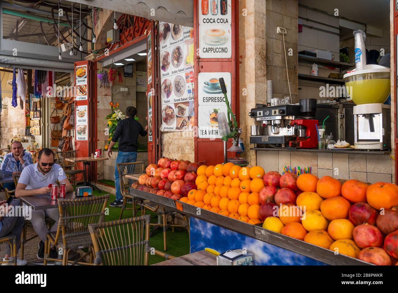 A colorful fruit stand selling fruit juices in the old city of ...