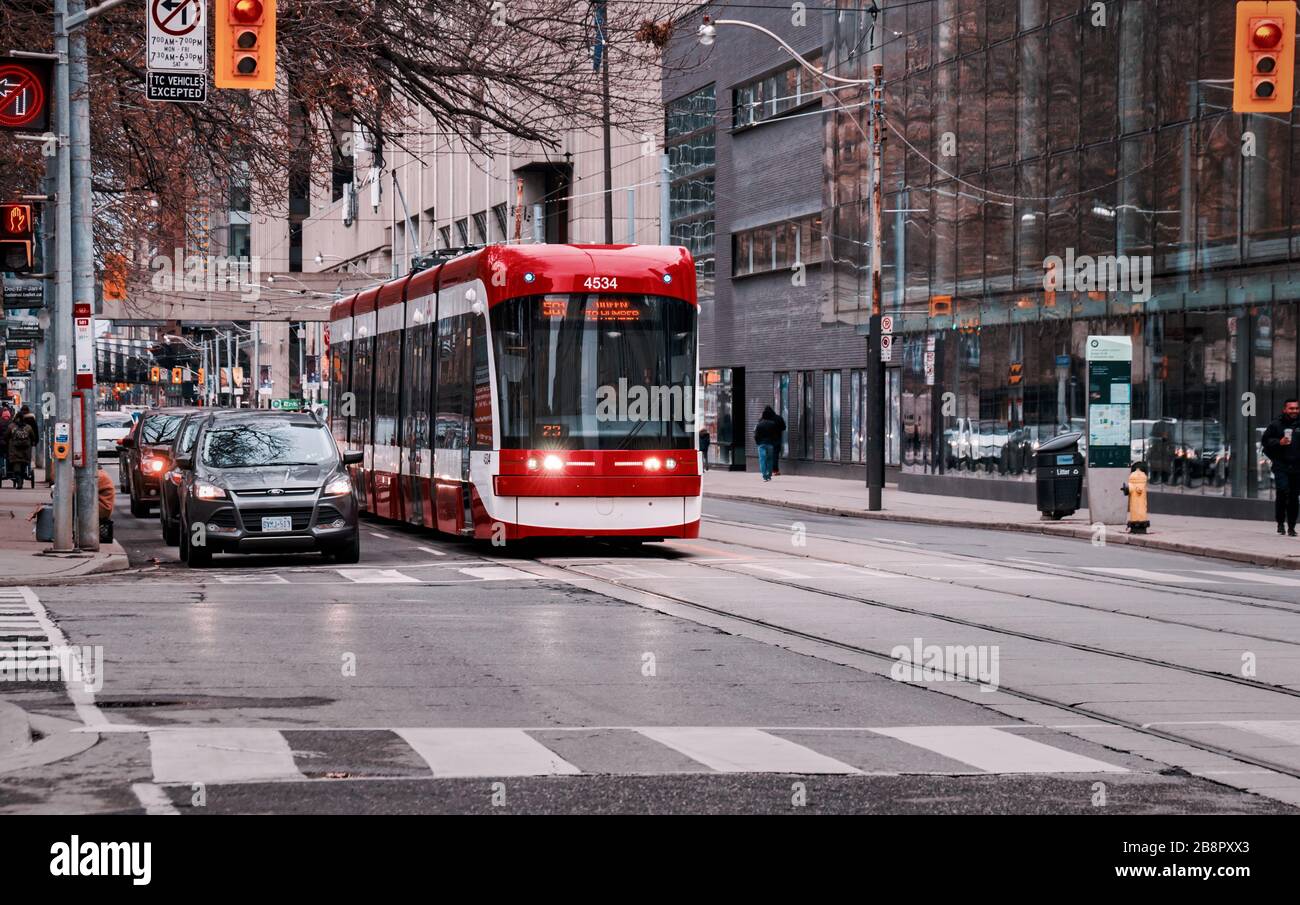 TORONTO, CANADA - 01 04 2020: A new Bombardier made streetcar and cars ...