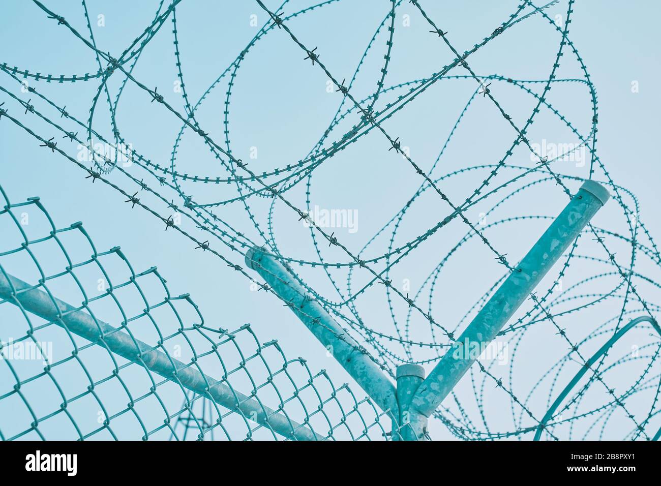 Border fence with barbed wire. Closing for quarantine. Maximum Security ...