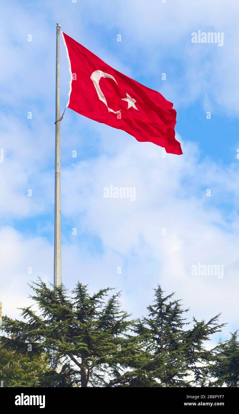 Turkish flag waving against blue cloudy sky Stock Photo - Alamy