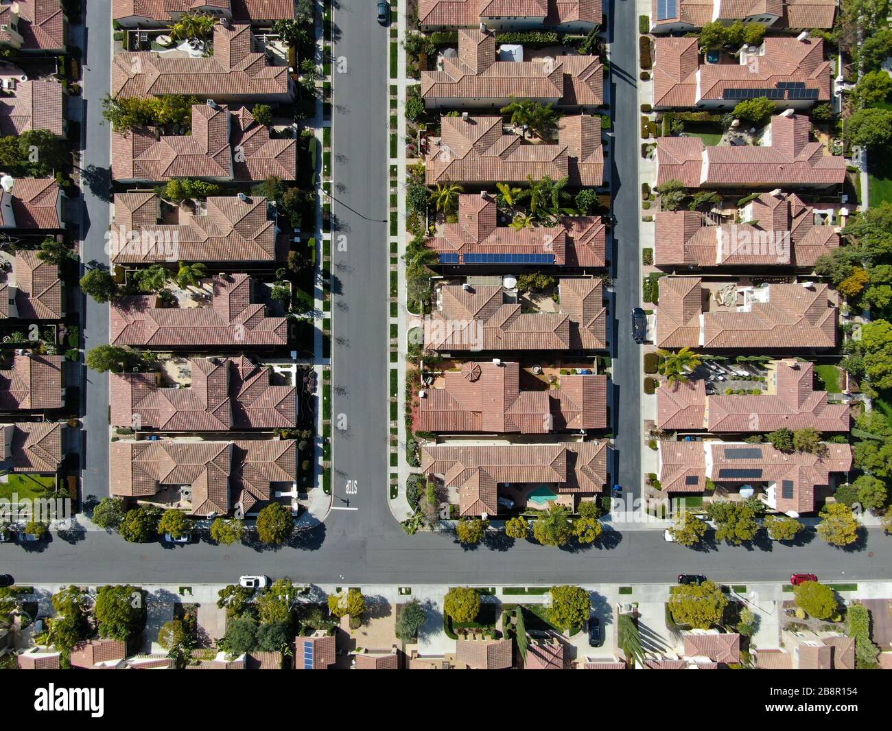 Aerial top view suburban neighborhood with identical villas next to ...