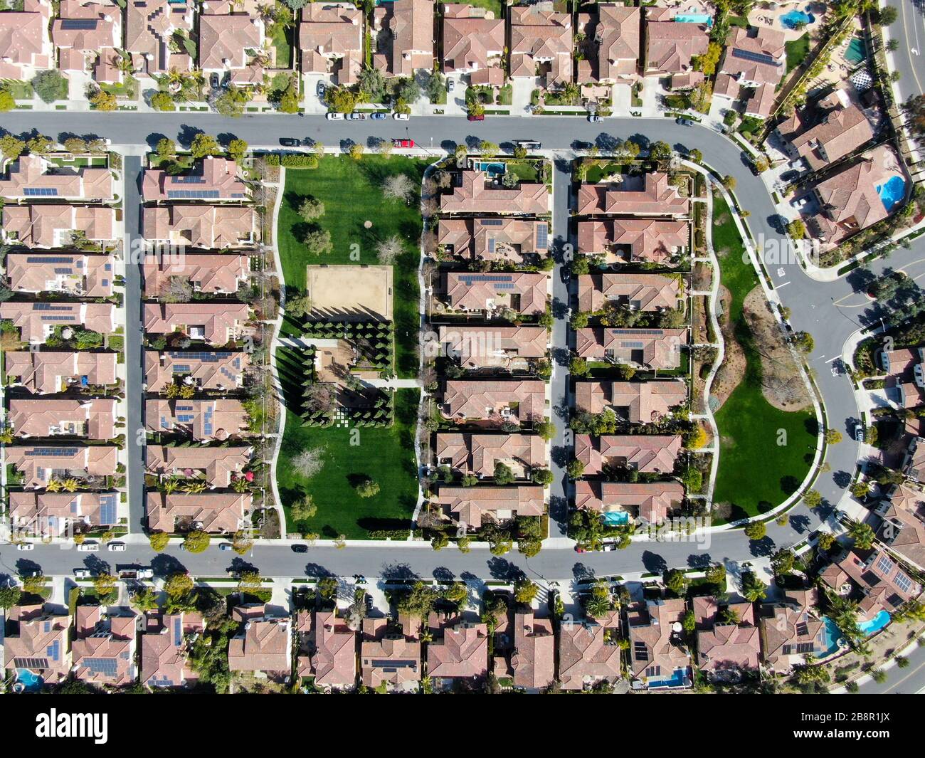 Aerial top view suburban neighborhood with identical villas next to ...