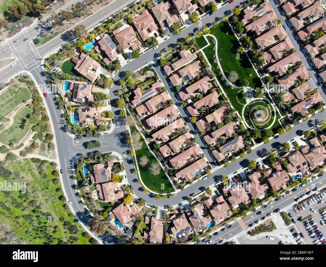 Aerial top view suburban neighborhood with identical villas next to ...