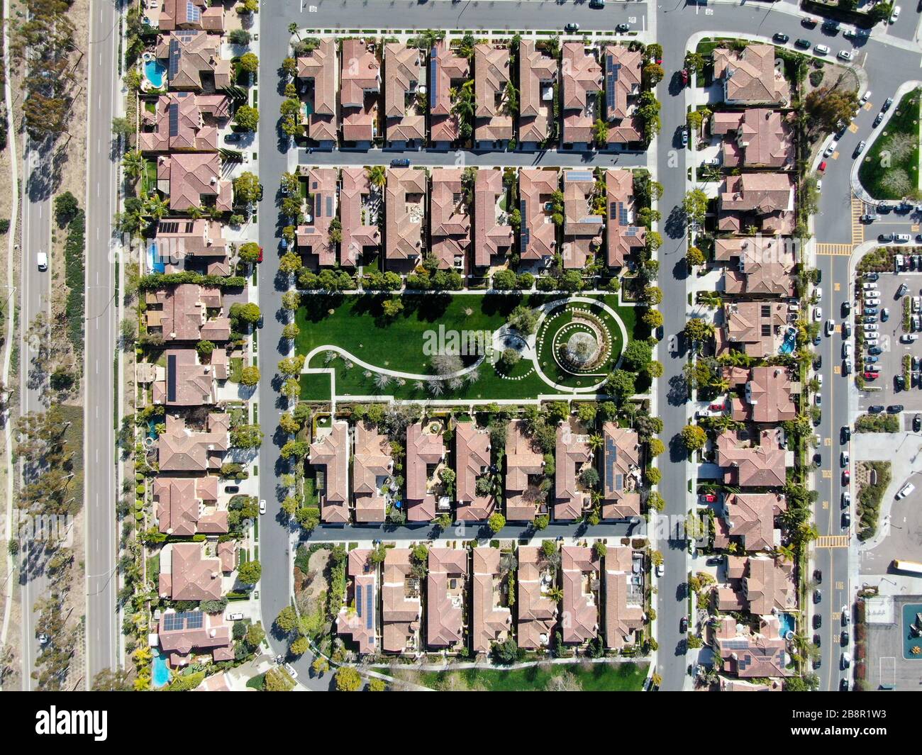 Aerial top view suburban neighborhood with identical villas next to ...