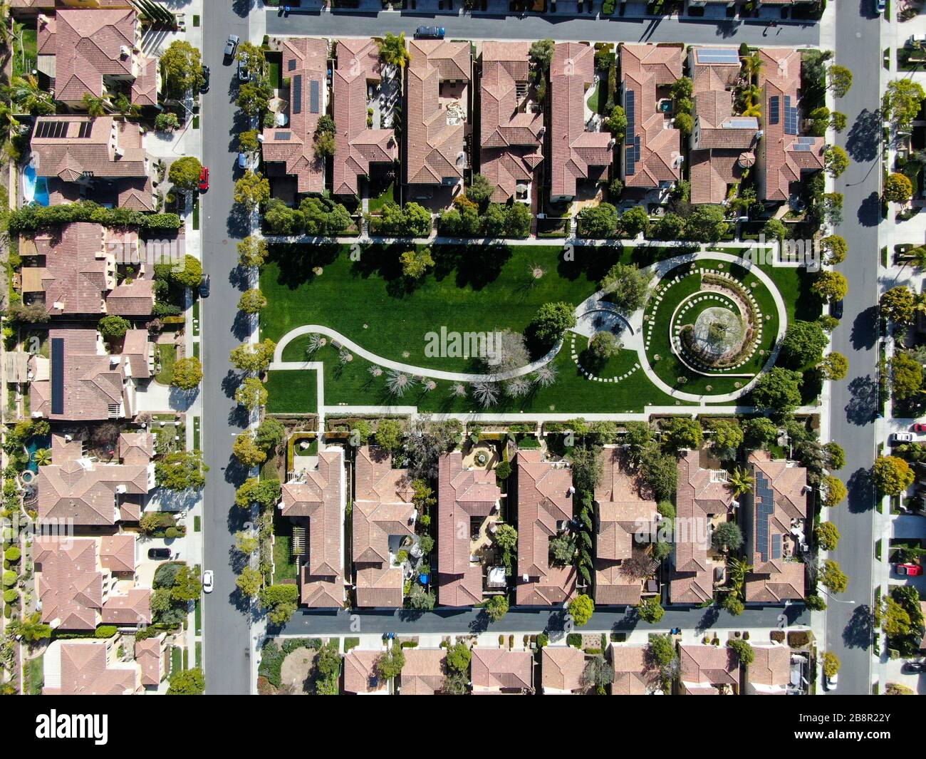 Aerial top view suburban neighborhood with identical villas next to ...