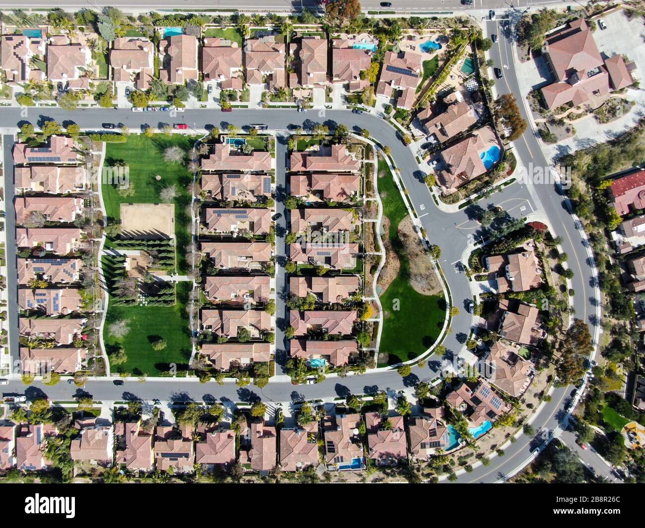 Aerial top view suburban neighborhood with identical villas next to ...