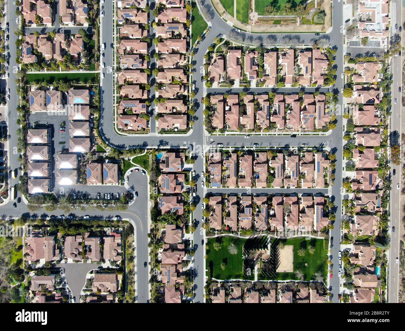 Aerial top view suburban neighborhood with identical villas next to ...