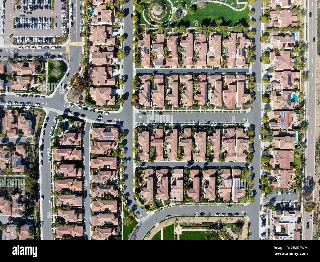 Aerial top view suburban neighborhood with identical villas next to ...