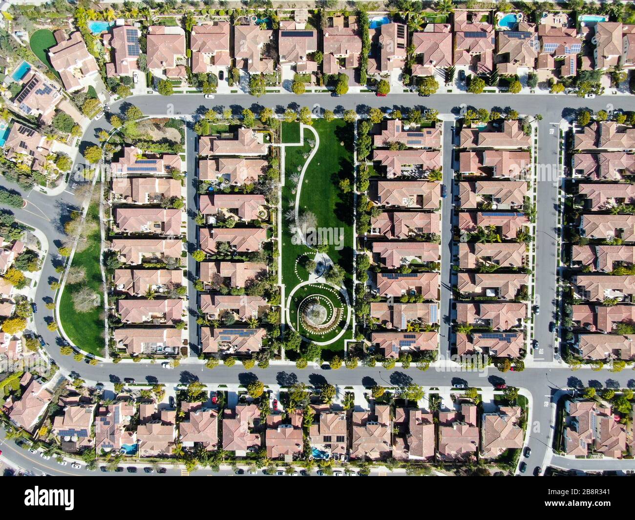 Aerial top view suburban neighborhood with identical villas next to ...