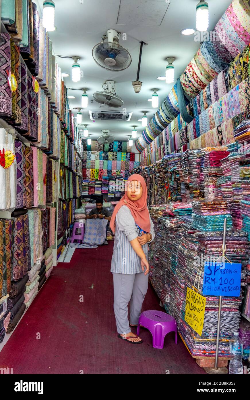 Muslim woman wearing tudung in a fabric and textile shop Kuala Lumpur ...
