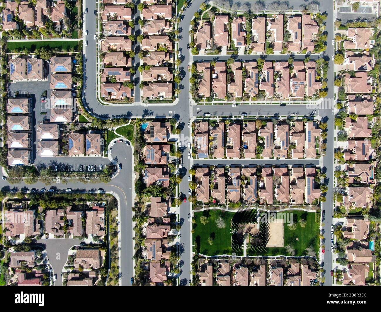 Aerial top view suburban neighborhood with identical villas next to ...