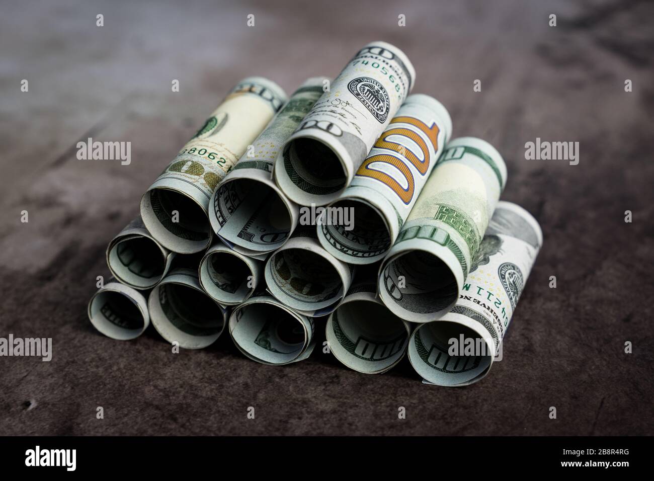US dollar bills in rolls Stock Photo - Alamy
