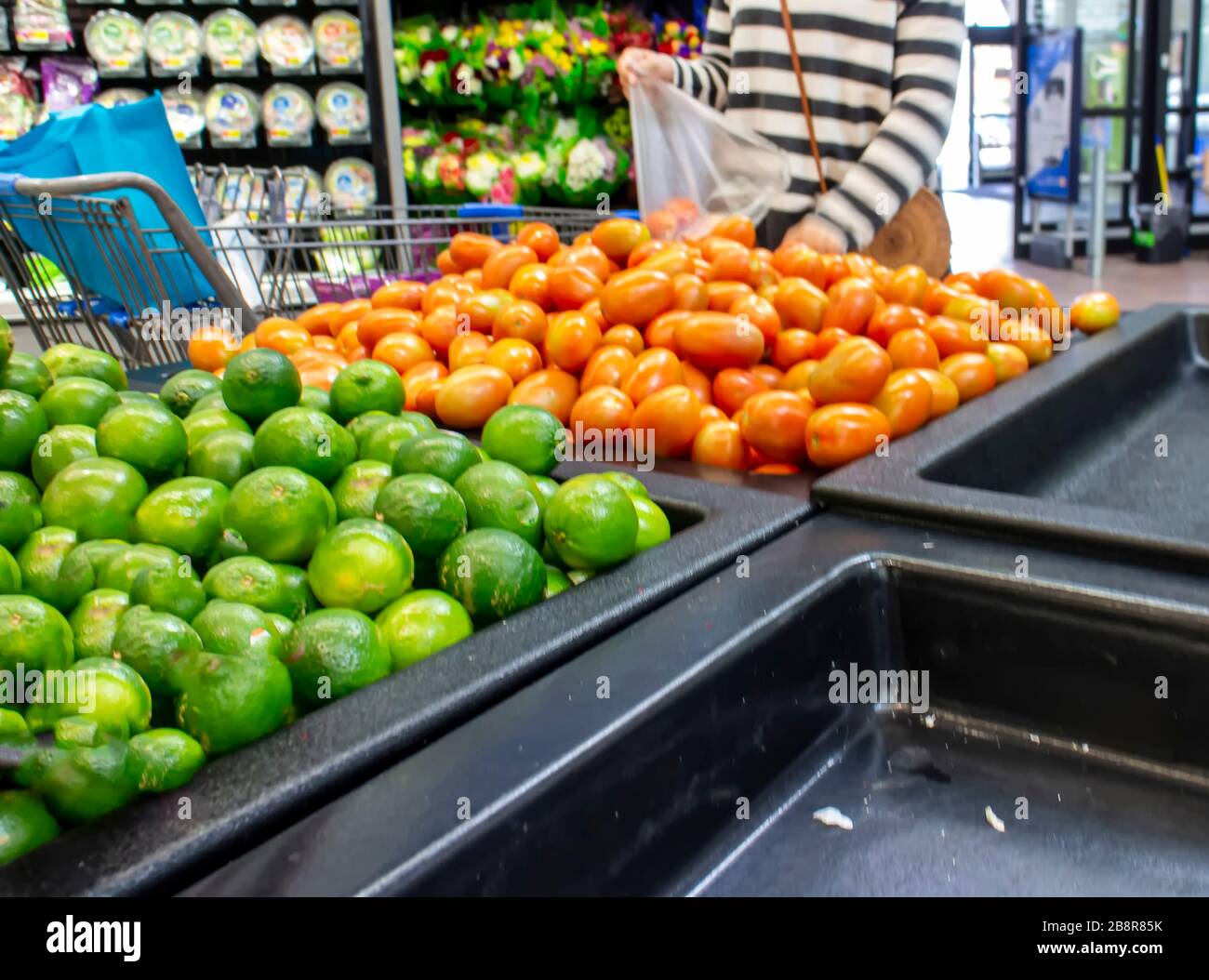 Half empty produce bin at a supermarket during coronavirus pandemic ...
