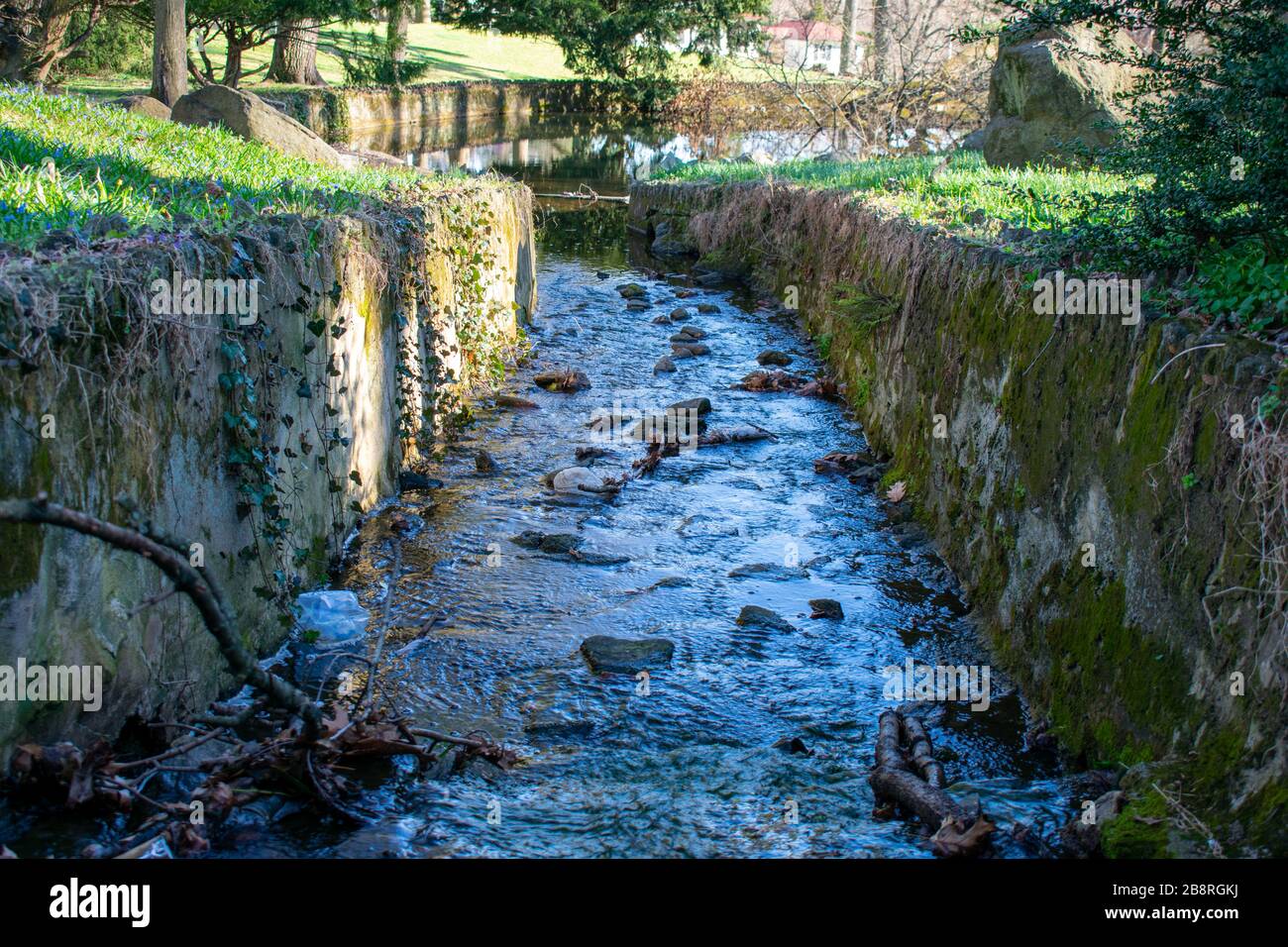 A Man Made Stream With Cobblestone Walls on Each Side Stock Photo - Alamy