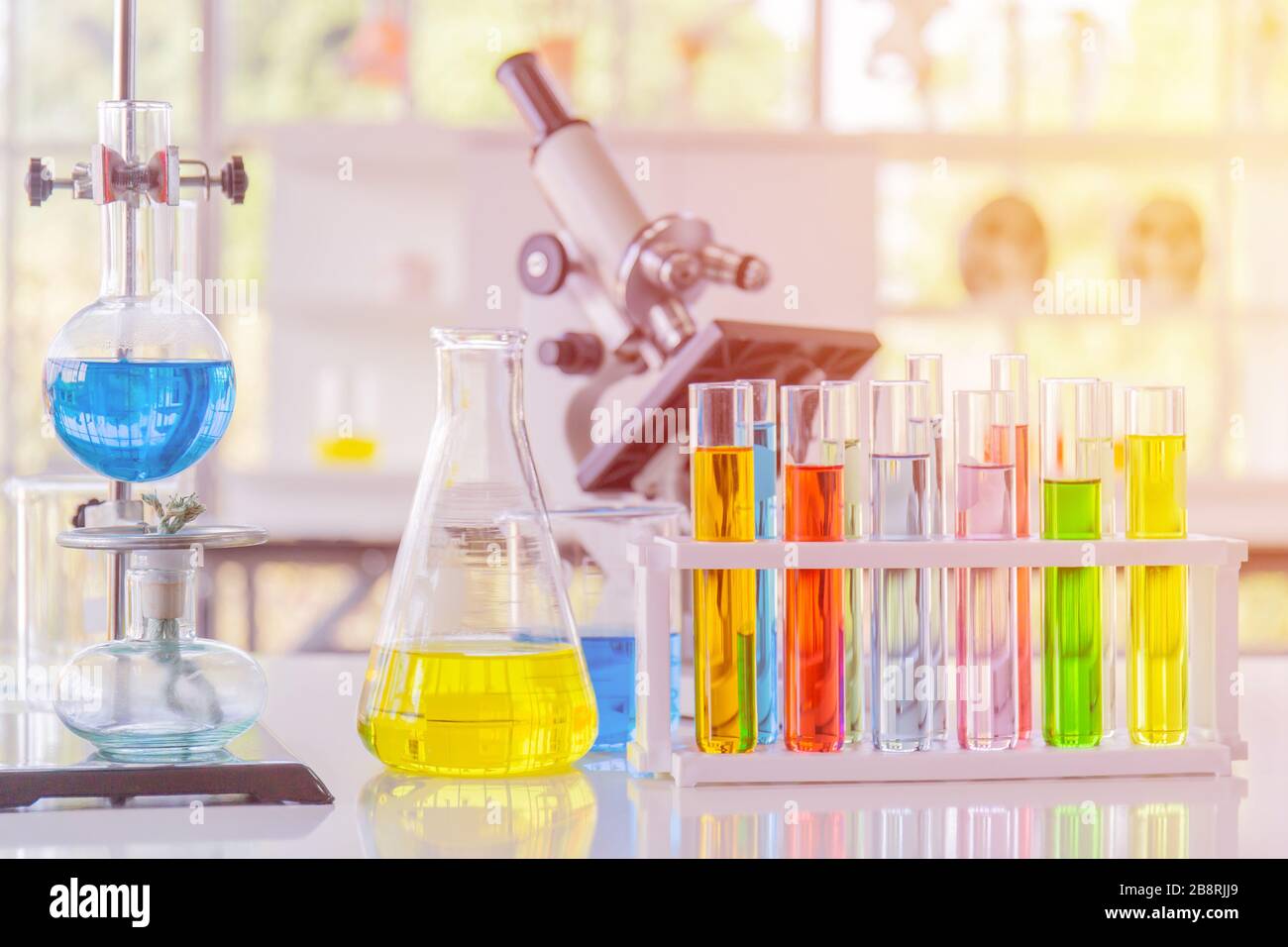 Chemical reagents in glass bottles of various shapes, scientific ...