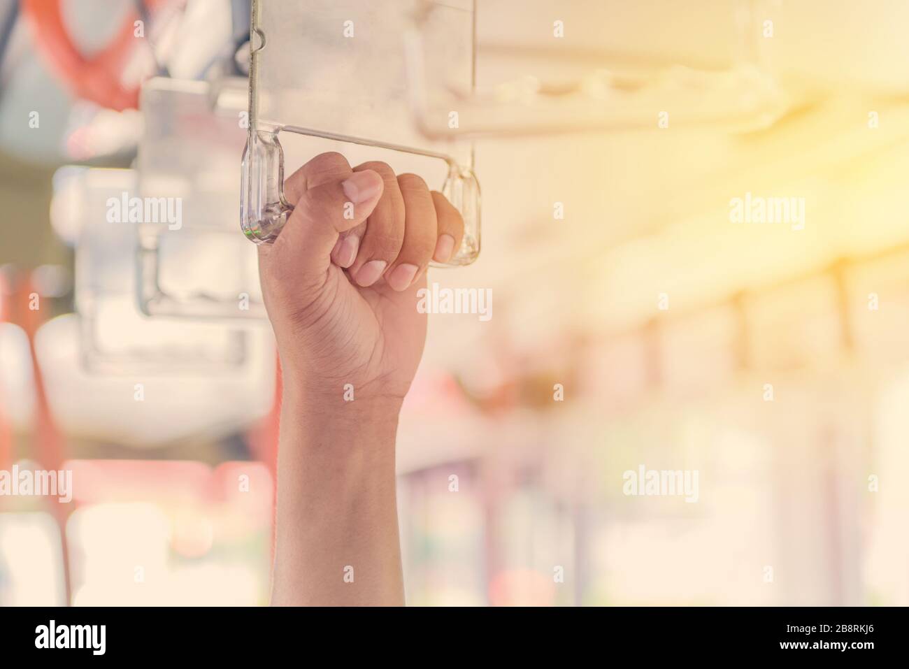 Handles standing passenger inside bus transportation hi-res stock ...