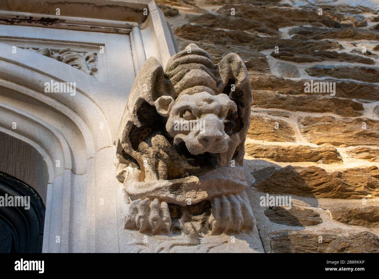 A Gargoyle Statue on an Old Cobblestone Building Stock Photo - Alamy