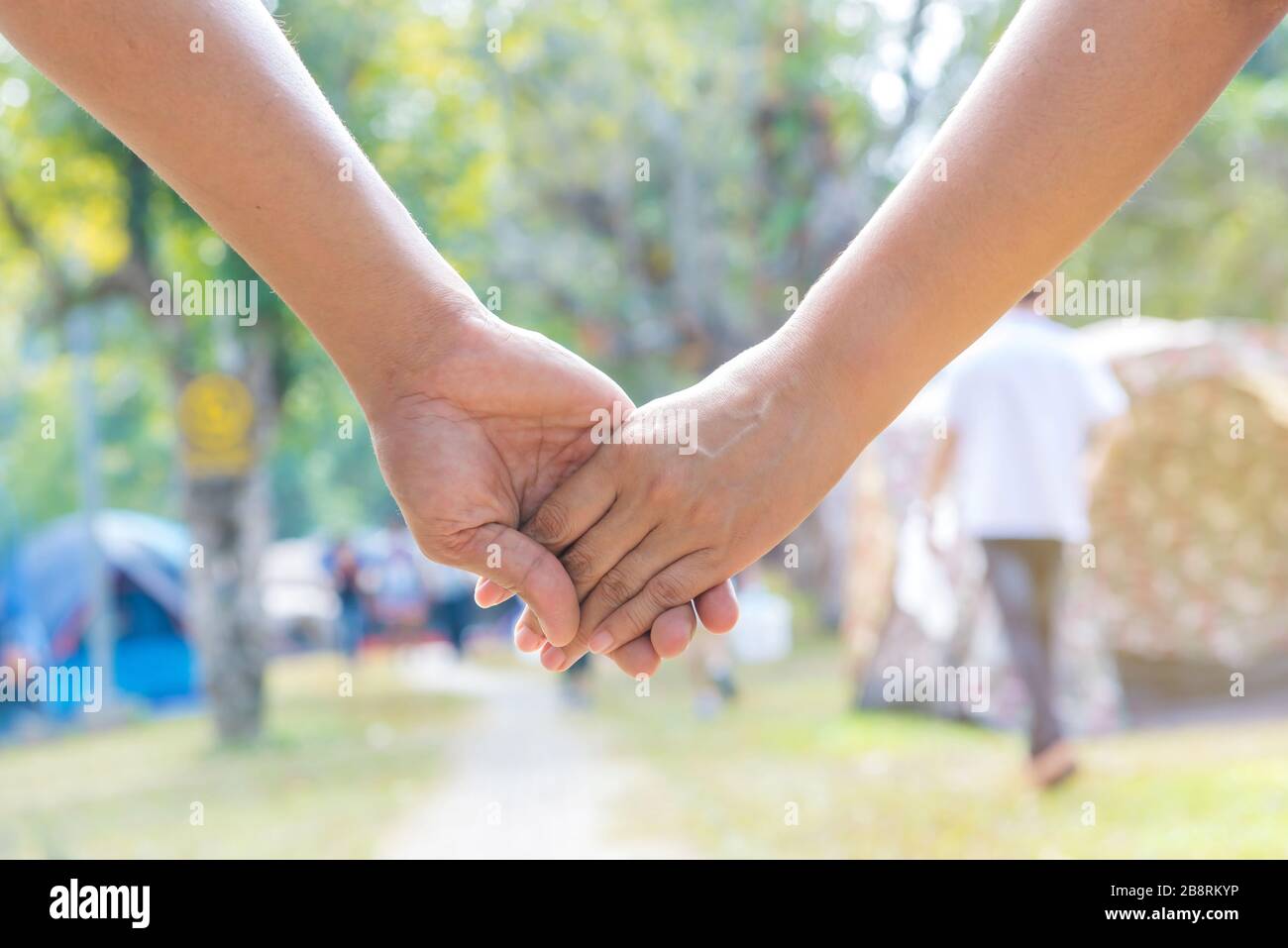 Happy couple holding hands together as forever love in Valentine day ...