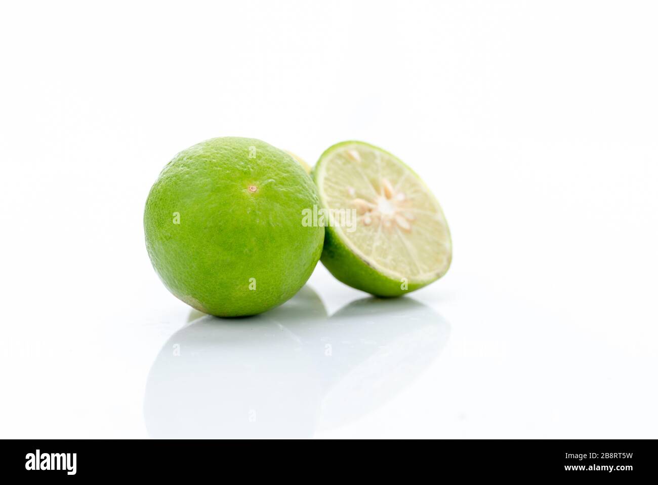 Fresh green lemon fruit isolated on white background Stock Photo - Alamy