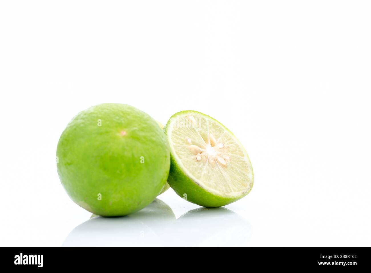 Fresh green lemon fruit isolated on white background Stock Photo - Alamy