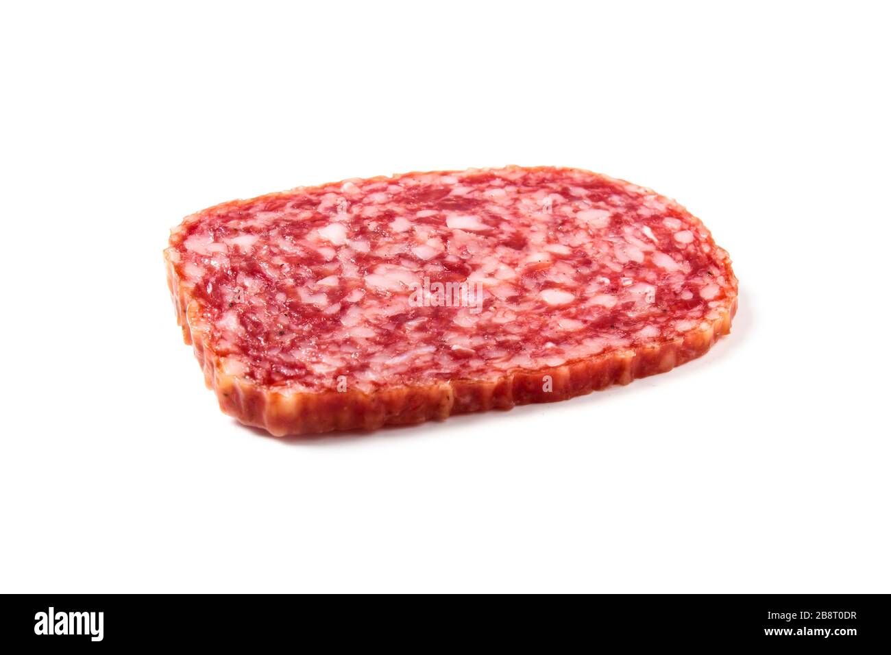 A piece of salami isolated on white background Stock Photo - Alamy