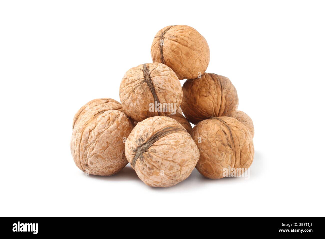 Handful of walnuts isolated on white background Stock Photo - Alamy