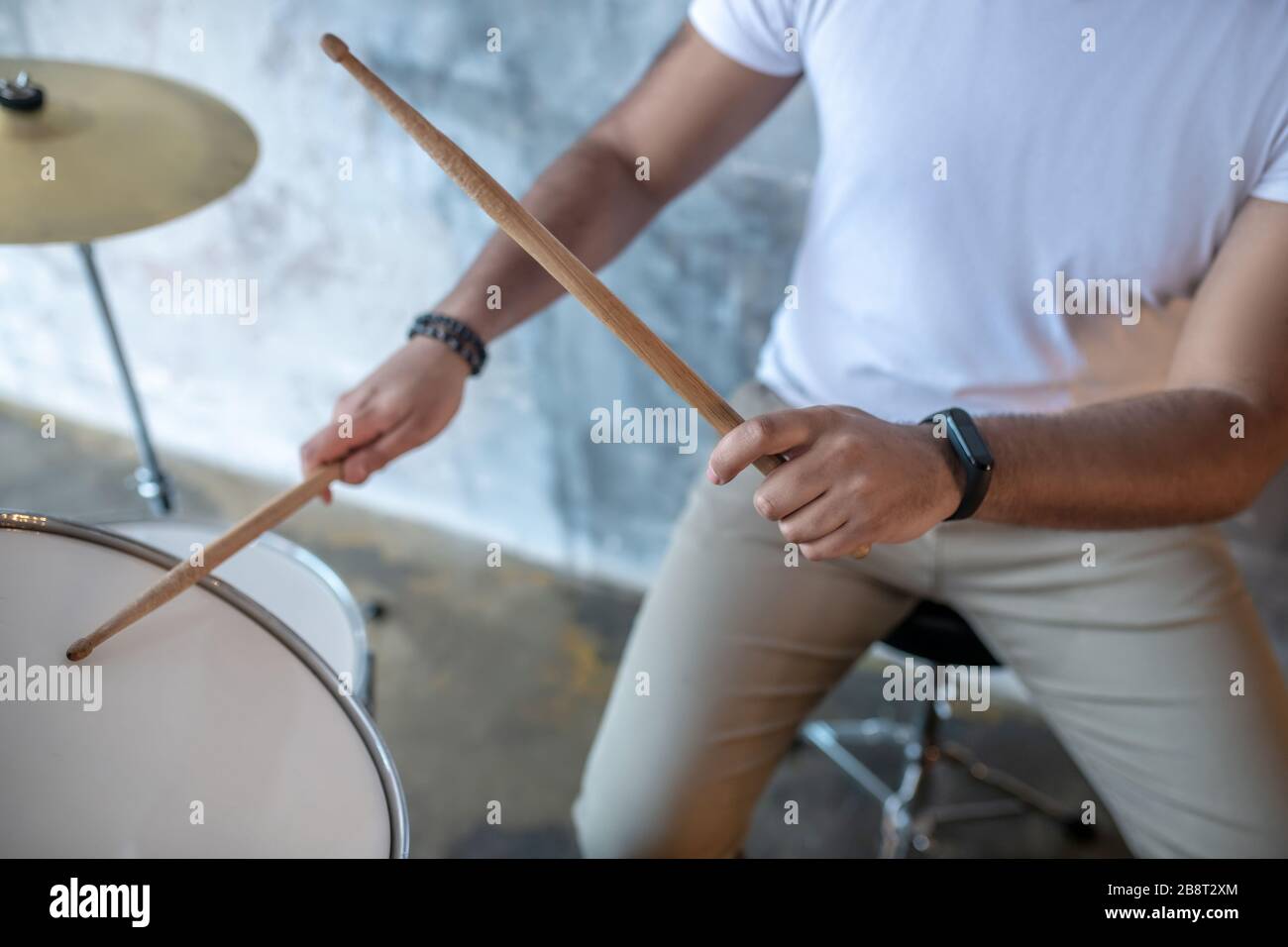 Hands holding drumsticks hi-res stock photography and images - Alamy