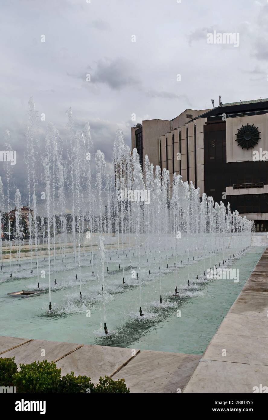 A close-up view of water fountains in front of the National Palace of ...