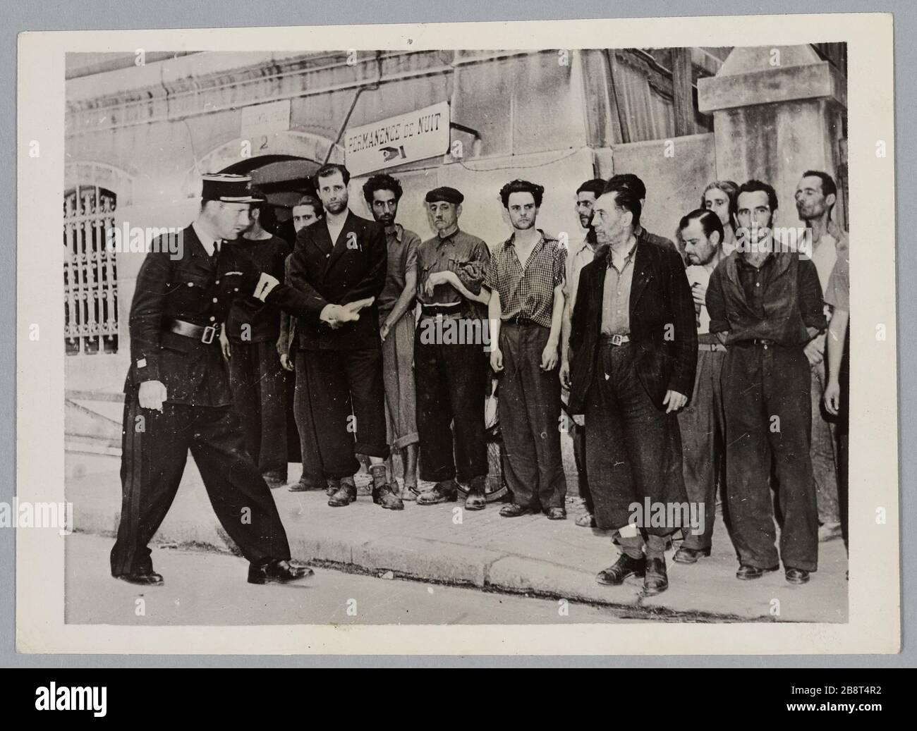 Employees gathered by a police captain before the police central ...