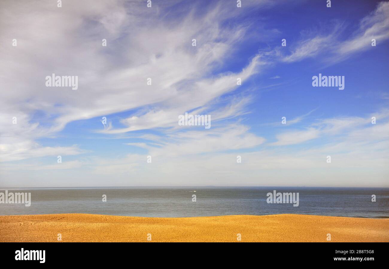 scenic view of the sand beach with sea and heaven, nazare, Portugal ...