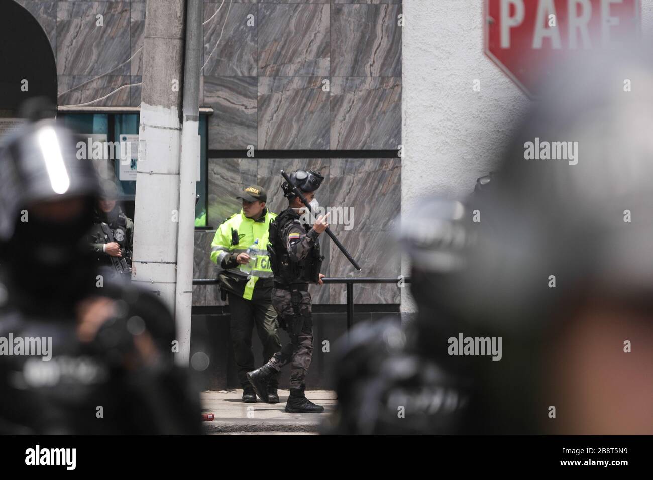 Bogota, Colombia. 22nd Mar, 2020. Policemen and prison guards stand ...